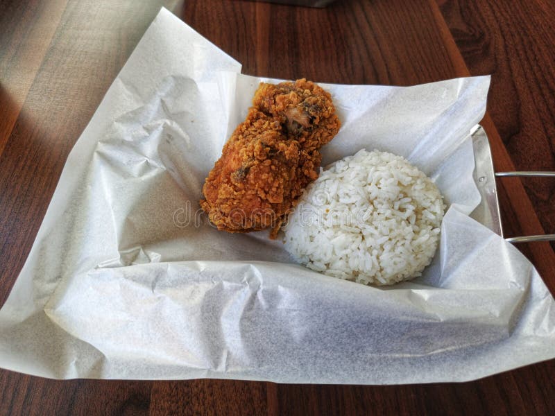 A Portion of Rice and Fried Chicken on an Environmentally Friendly ...