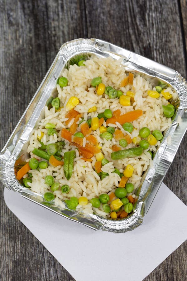 Portion of Rice with Mixed Vegetables in a Foil Takeaway Container and ...