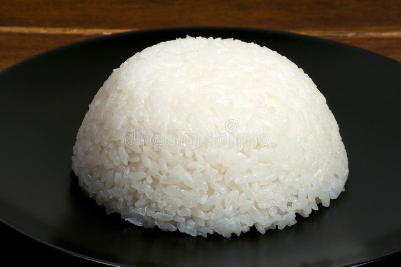 Portion of Rice on the Plate Top View with Sesame Seeds Stock Photo ...