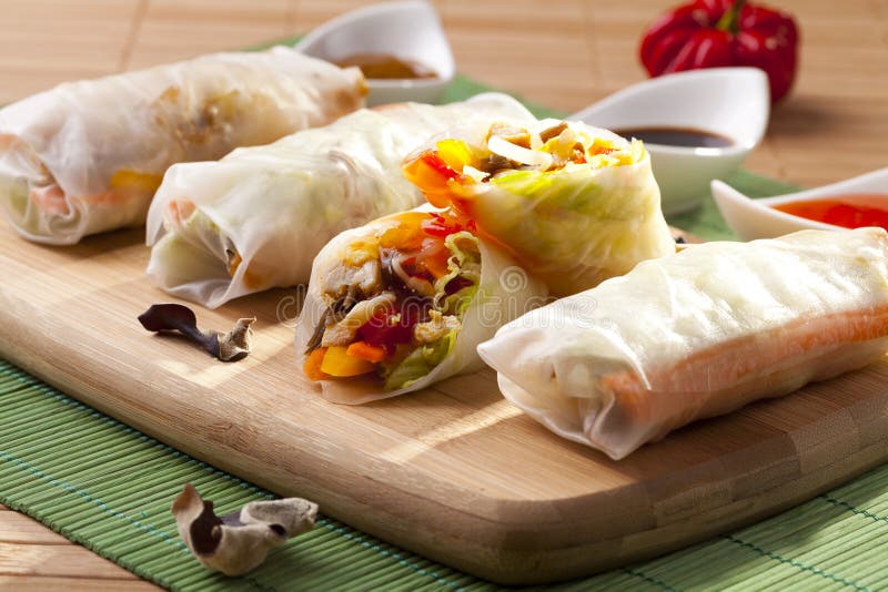 Portion of Spring Rolls on a Bamboo Board Stock Photo - Image of finger ...