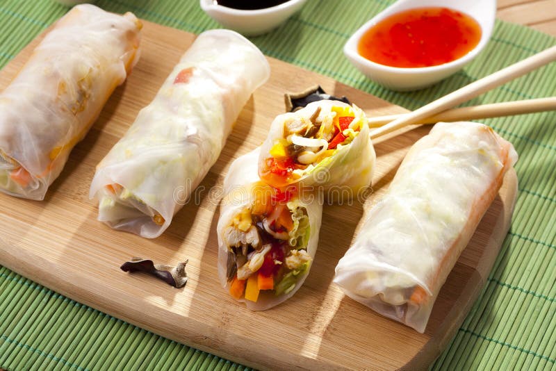 Portion of Spring Rolls on a Bamboo Board Stock Image - Image of paper ...