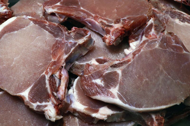 Portions of Pork Ribs or Chop Preparing in a Butchery Section Stock ...