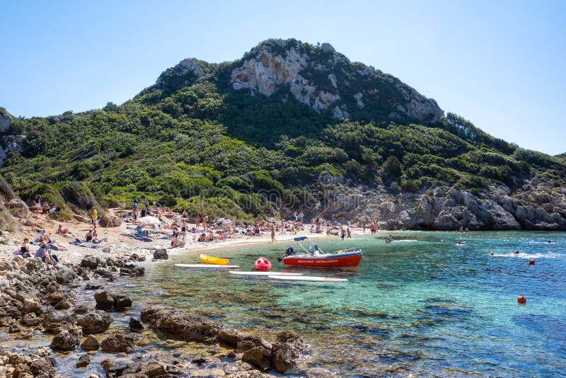 Porto Timoni Beach with Boat Stock Photo - Image of island, green ...