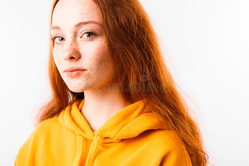 Portrait Of An Emotional Red Haired Girl With Freckles And Braces On A