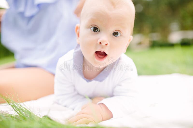 Portrait of Ababy on the Grass Stock Photo - Image of hand, cheerful ...