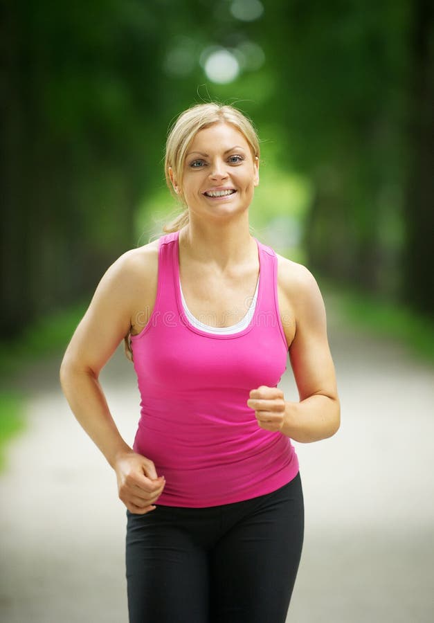 Portrait of an Active Young Woman Jogging in the Park Stock Image ...