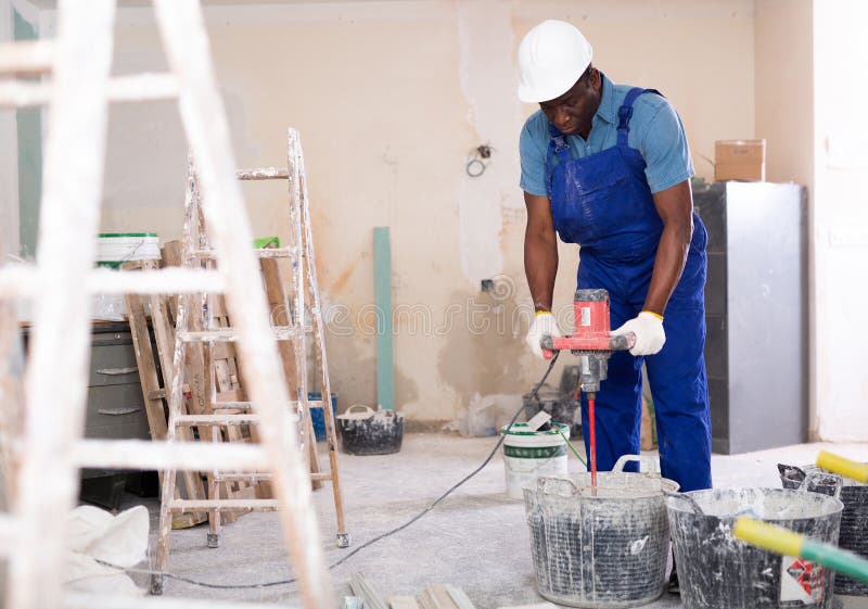 Portrait of an African American Builder, Working in the Process of ...