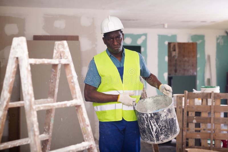 Portrait of an African American Builder, Working in the Process of ...