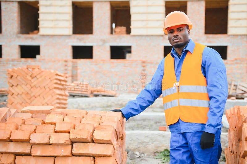 Portrait of an African American Construction Worker. a Builder Builds a ...