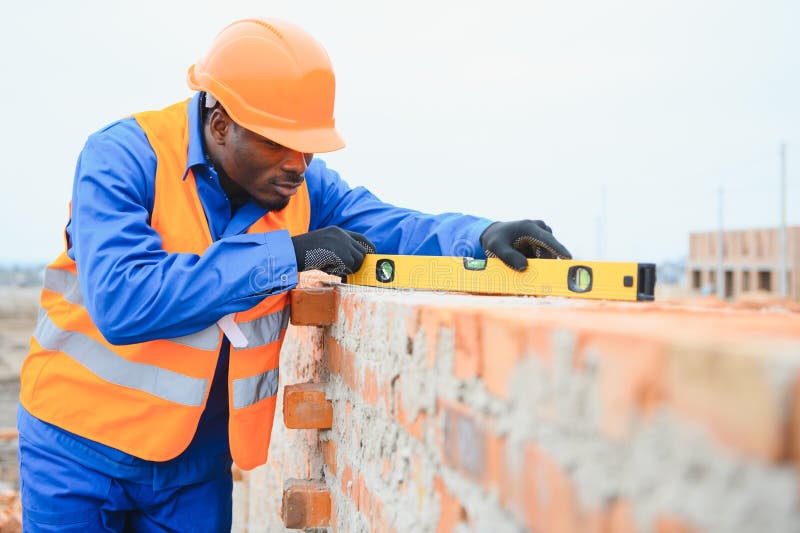 Portrait of an African American Construction Worker. a Builder Builds a ...