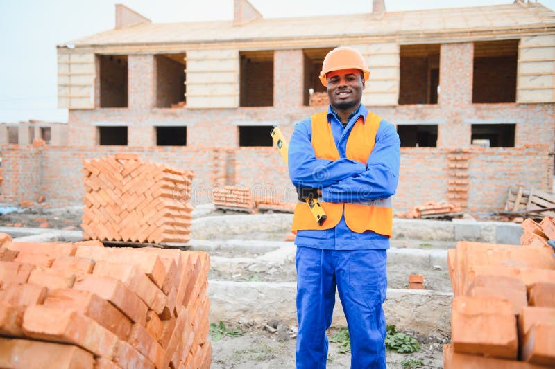 Portrait of an African American Construction Worker. a Builder Builds a ...
