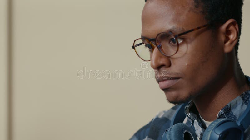 Portrait of African American Database Developer with Glasses Working ...