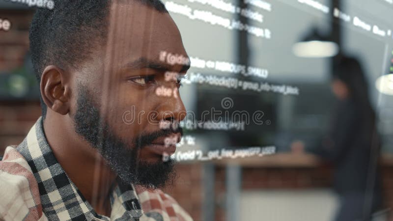 Static Portrait of African American System Engineer Working Focused ... Static Portrait of African American System Engineer Working Focused ...