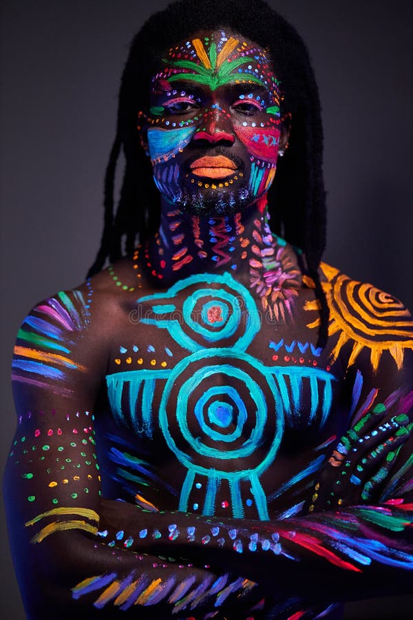 Portrait of African Man with Ethnic Pattern, Neon Makeup in Ultraviolet ... Portrait of African Man with Ethnic Pattern, Neon Makeup in Ultraviolet ...
