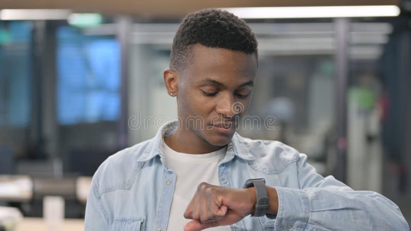 Portrait of African Man Waiting while Checking Time Stock Photo - Image ...
