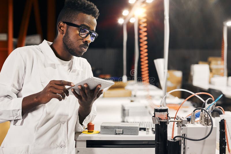 African Engineer with Tablet at Factory Stock Photo - Image of tapping ...