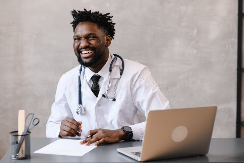 Portrait of Afro American Doctor Using Laptop Computer. Online ...