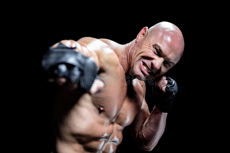 Aggressive MMA Fighter Punching Opponent on Floor on Mat at Gym, during ...