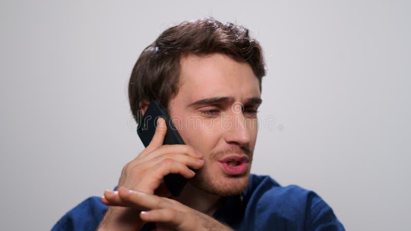 Man Talking on Phone in Studio. Guy Screaming during Phone Conversation ...