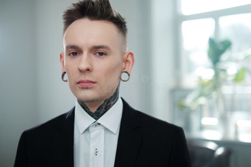 Portrait of Alternative Model with Earplugs and Tattoo Stock Photo ...