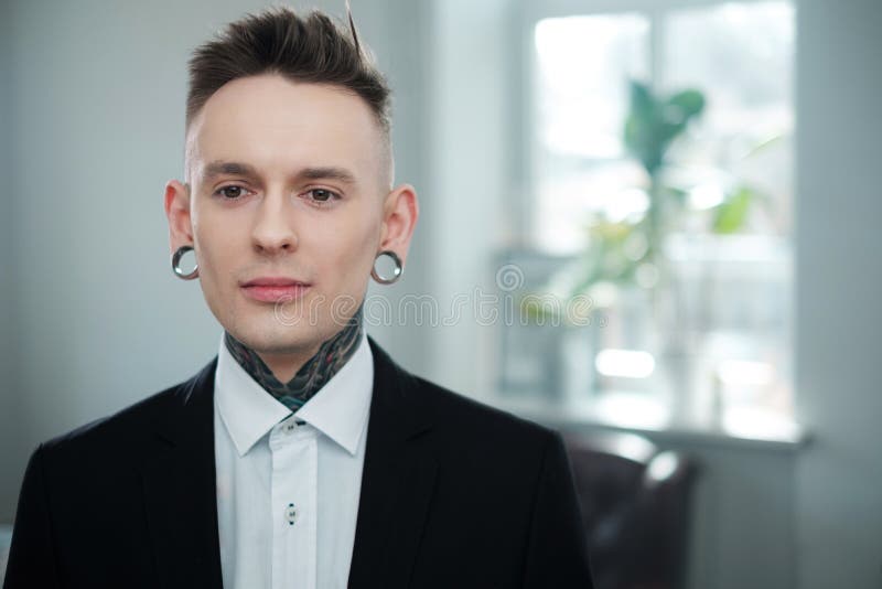 Portrait of Alternative Model with Earplugs and Tattoo Stock Photo ...