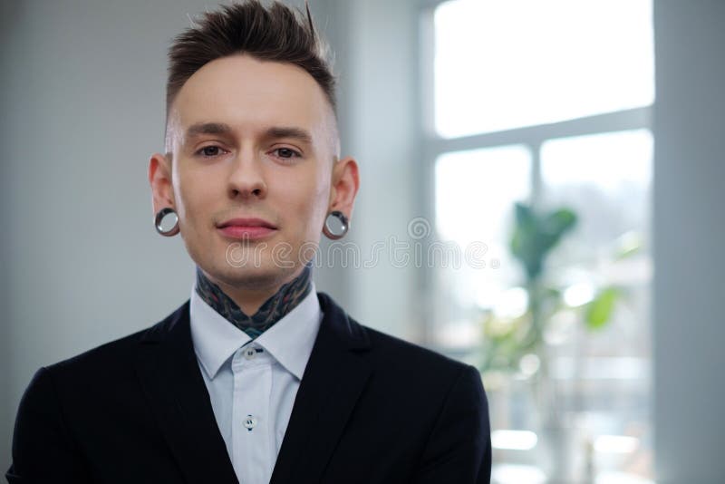 Portrait of Alternative Model with Earplugs and Tattoo Stock Photo ...