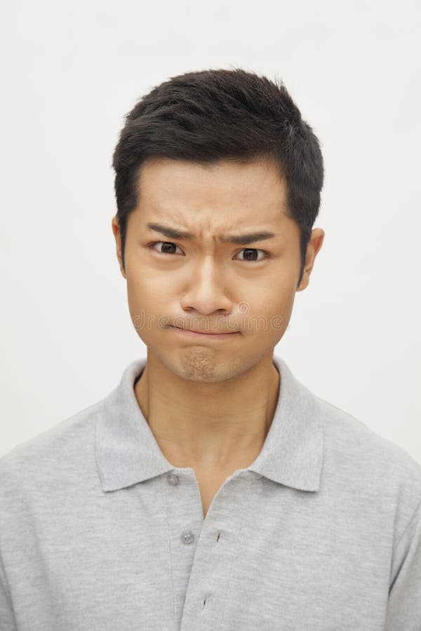 Portrait of Angry and Frustrated Young Man, Studio Shot, Looking at ...