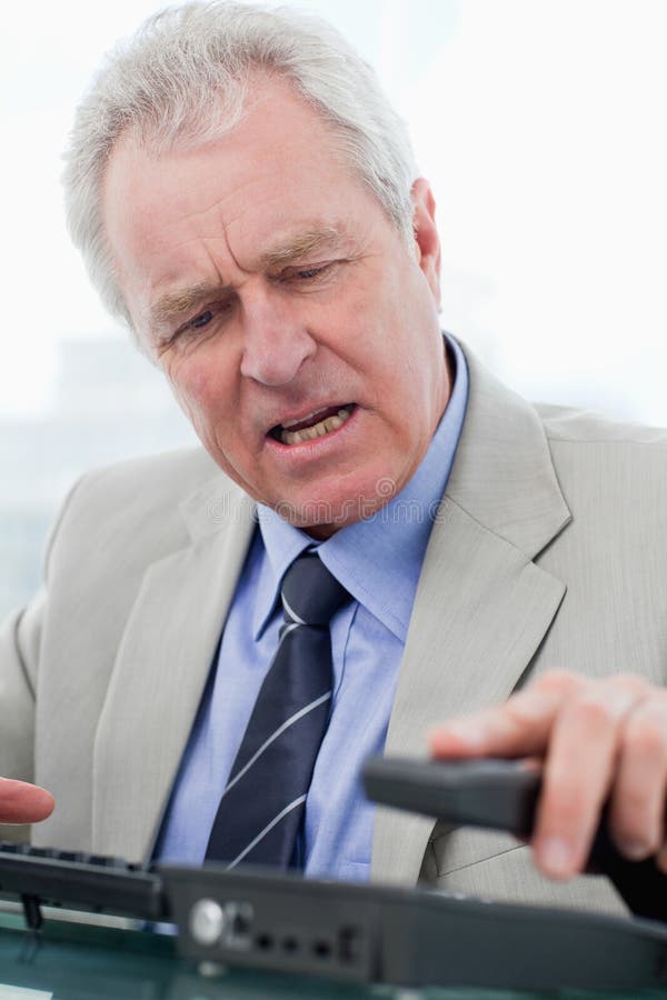 Portrait of an Angry Senior Manager Hanging Up Stock Image - Image of ...