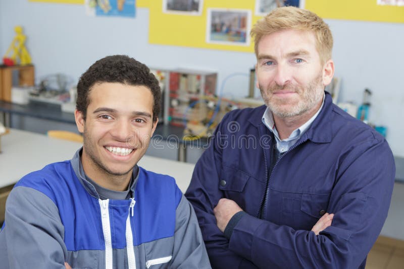 Portrait Apprentice and Engineer in Workshop Stock Photo - Image of ...