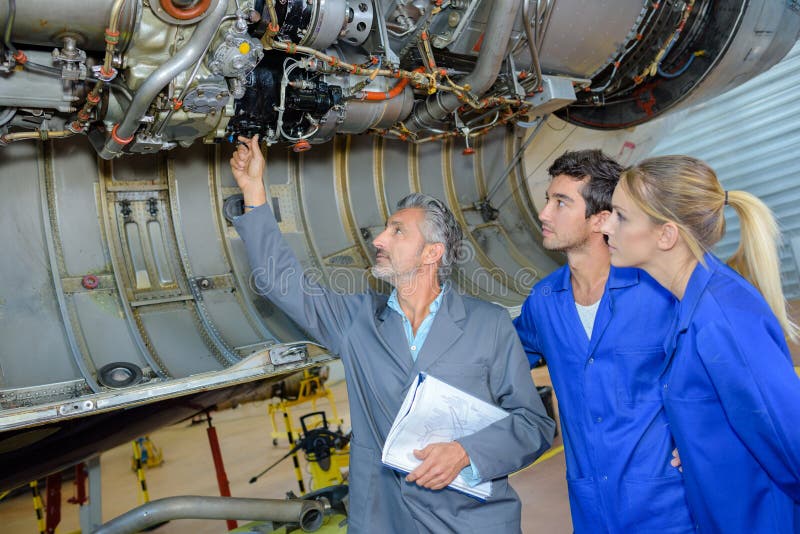 Portrait Apprentices Inspecting Wings Stock Image - Image of management ...