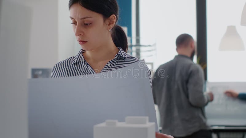 Portrait of Architect Analyzing Blueprints Plan To Work on Construction ...