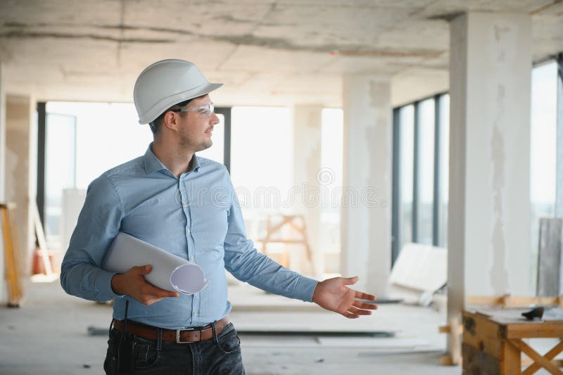 Portrait of an Architect Builder Studying Layout Plan of the Rooms ...