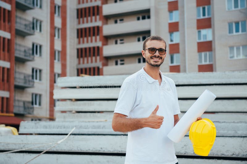 Portrait of an Architect Builder Studying Layout Plan of the Rooms ...