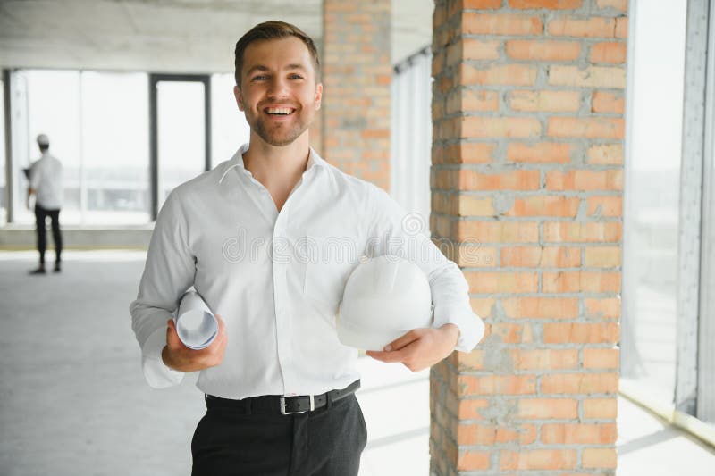 Portrait of an Architect Builder Studying Layout Plan of the Rooms ...
