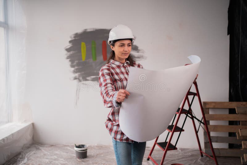 Portrait of an Architect Builder Working with Documents on Construction ...