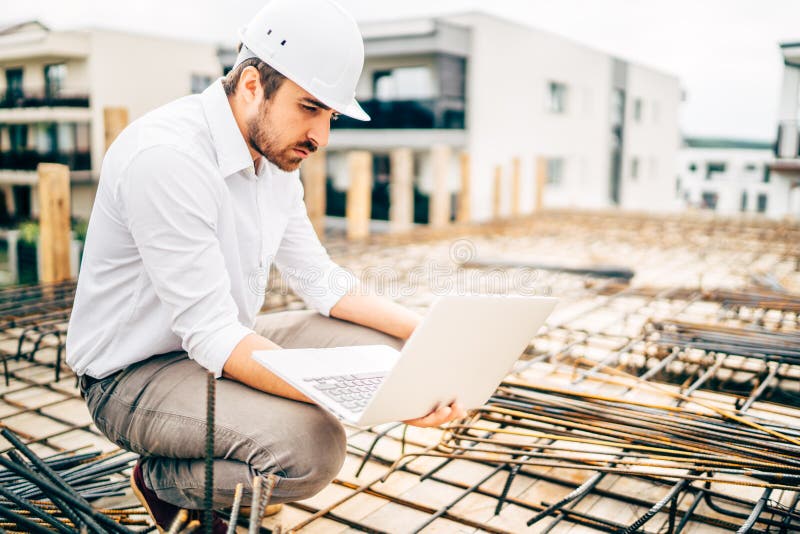 Architect Using Laptop for Construction Site. Worker on Site Stock ...