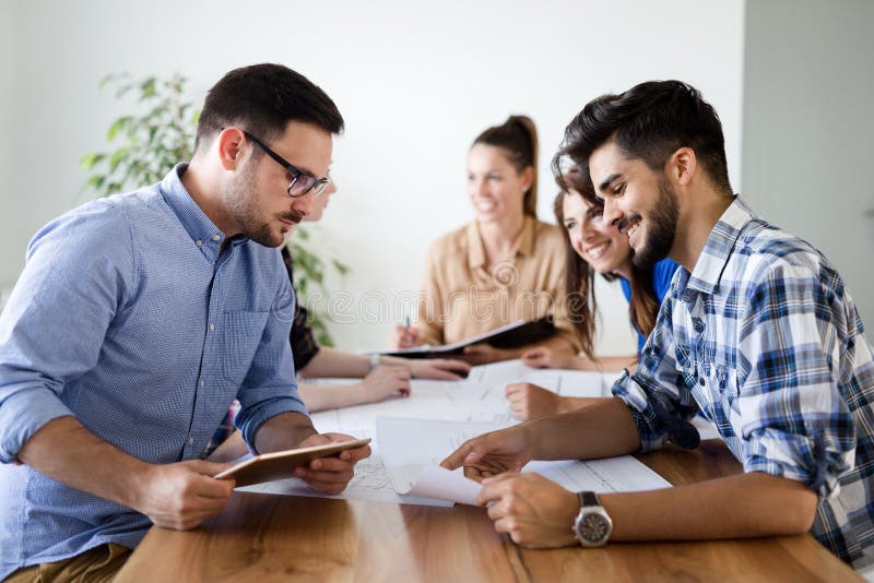 Portrait of Architects Having Discussion in Office Stock Photo - Image ...