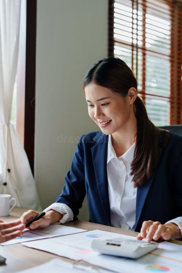 Portrait of an Asian Accountant Checking Accounts for Customers Stock ...
