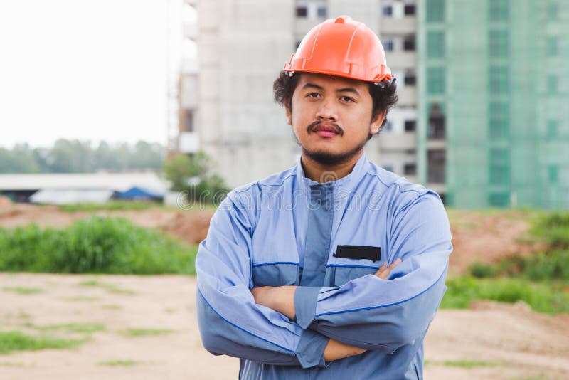 Asian Engineer with Construction Building and Crane As Background Stock ...