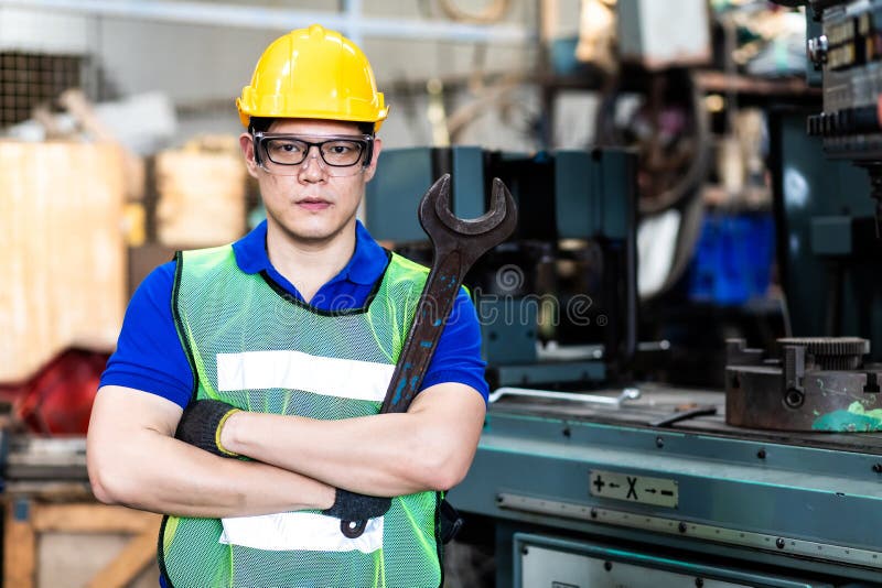 Portrait Asian Engineering Man in an Industrial Manufacturing Facility ...