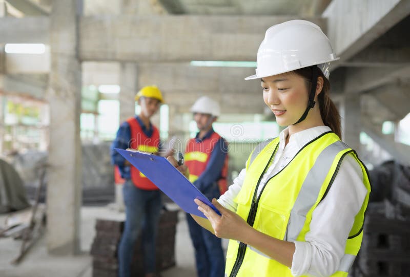Portrait an Asian Female Engineer Checking the Accuracy of Building ...
