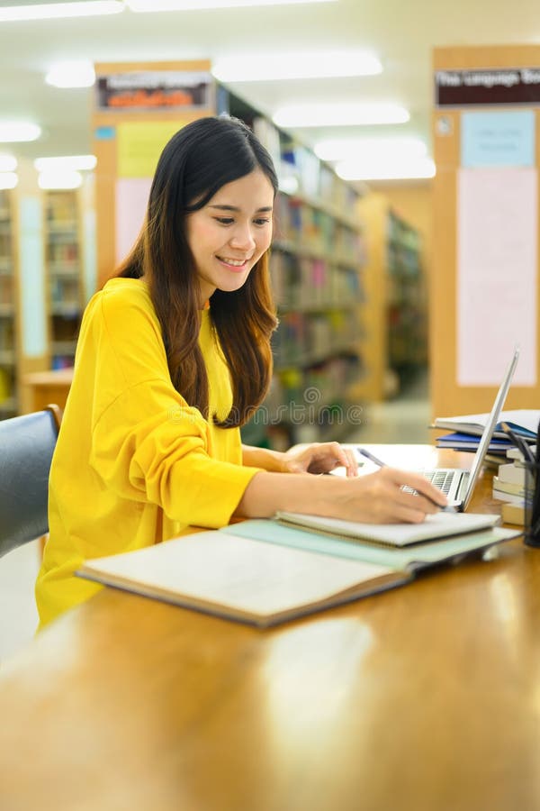 Portrait of Asian Female Student Doing Class Assignment and Searching ...