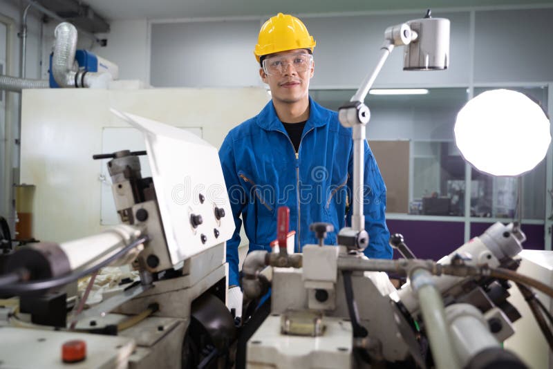 Portrait of Asian Maintenance Engineer Workers Working Machines in the ...
