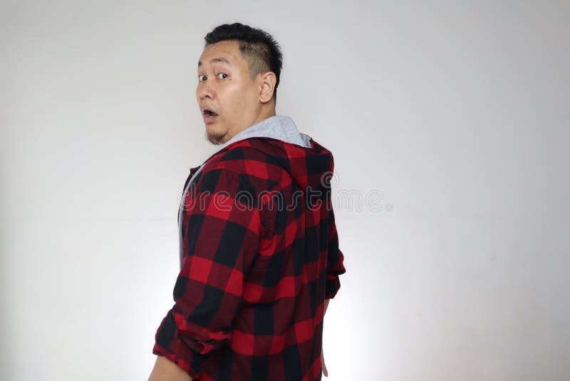 Asian Man Looking Behind His Back Over Shoulder with Shocked Surprised Expression Stock Photo ...