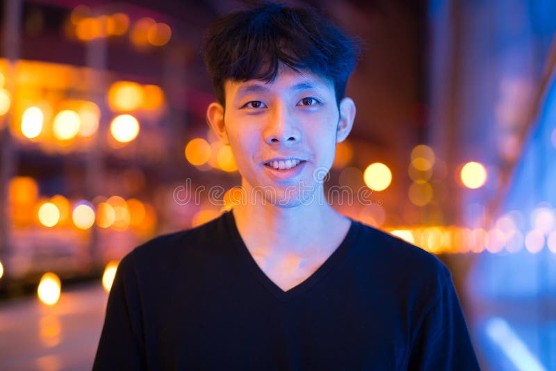 Portrait of Asian Man Smiling Outdoors at Night Stock Photo - Image of ...