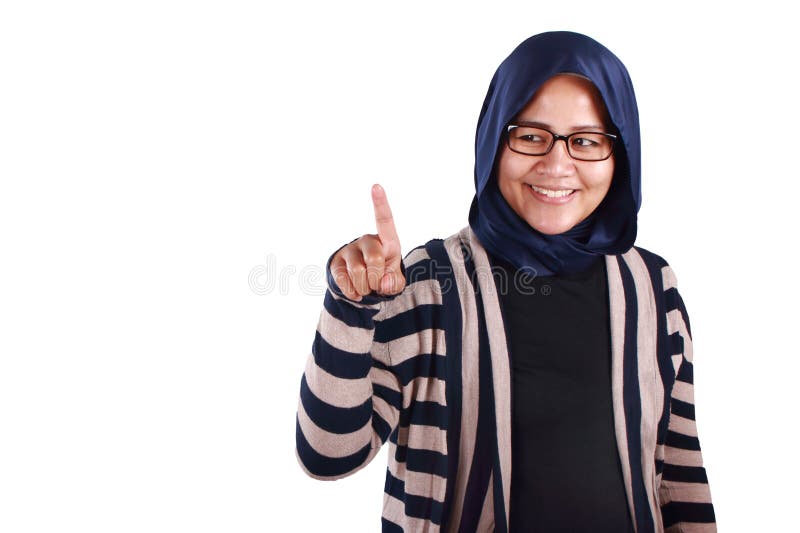 Portrait of Asian Muslim Woman Smiling Happily with Finger Pointing or ... Portrait of Asian Muslim Woman Smiling Happily with Finger Pointing or ...