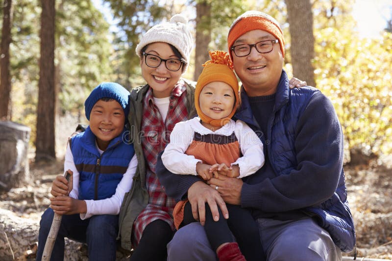 Portrait of Asian Parents and Two Kids in a Forest Stock Photo - Image ...