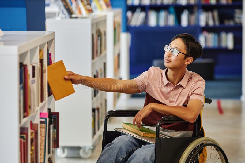 Student with Disability Choosing Books in Library Stock Image - Image ...