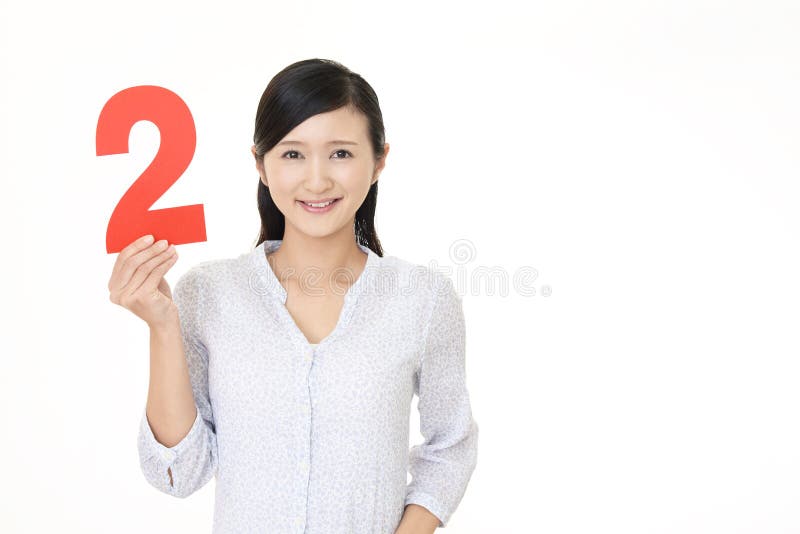 Woman with a number stock photo. Image of comfortable - 135436818