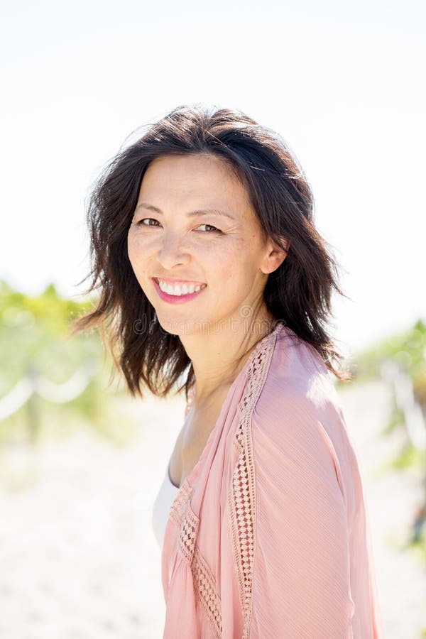 Portrait of a Beautiful Asian Woman Smiling. Stock Image - Image of ... Portrait of a Beautiful Asian Woman Smiling. Stock Image - Image of ...